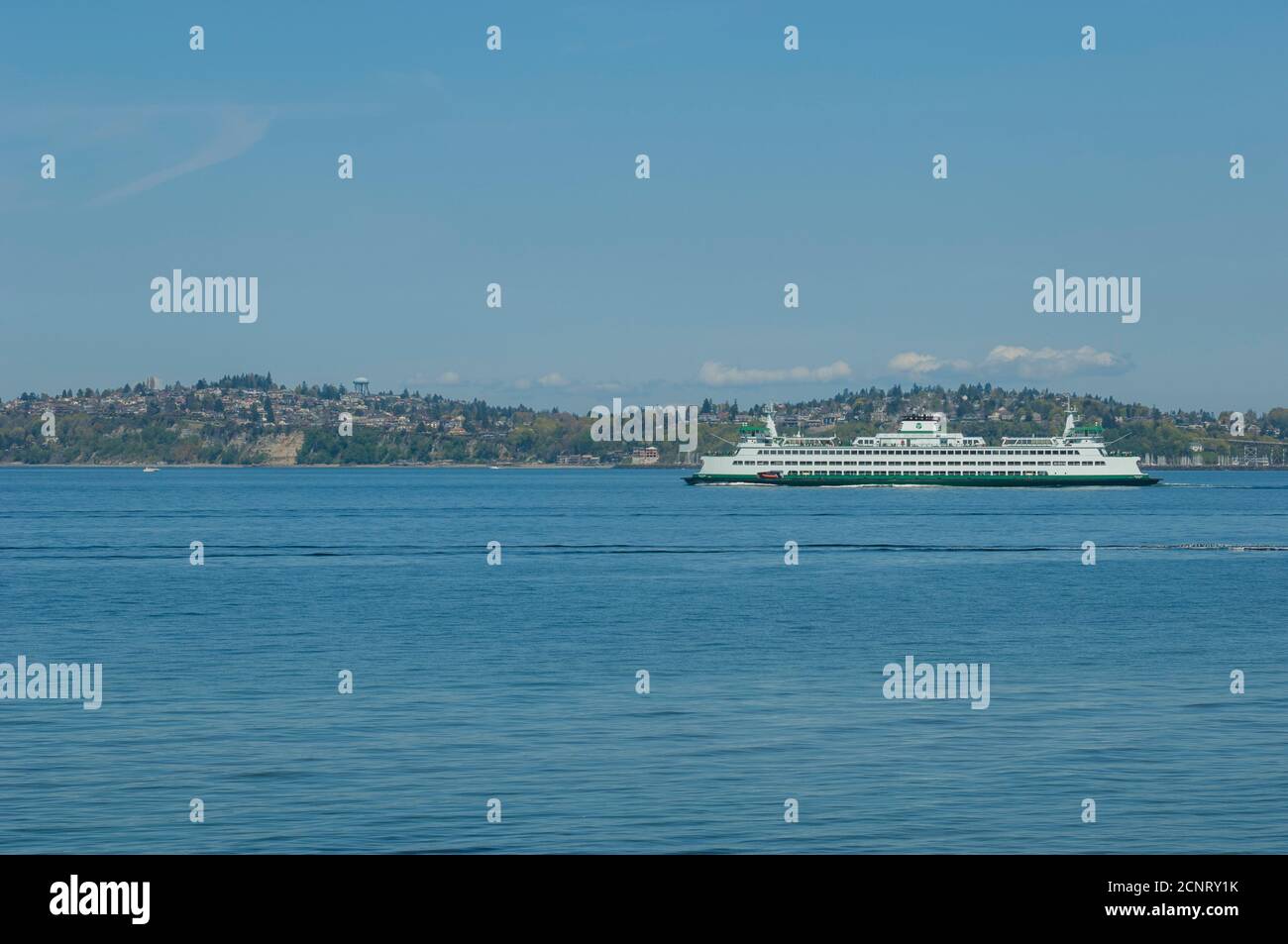 View of Puget Sound with a ferry from Alki Beach in West Seattle ...