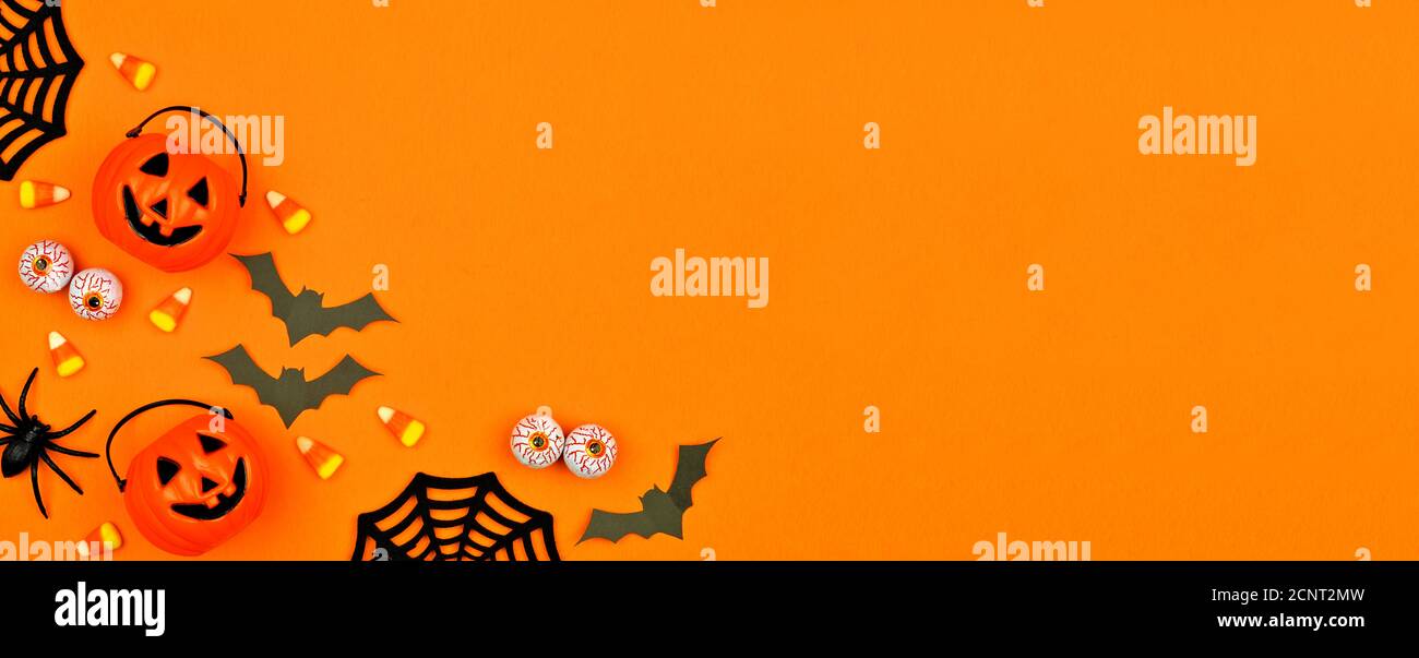 Halloween corner border banner with scattered candy and decor. Flat lay ...