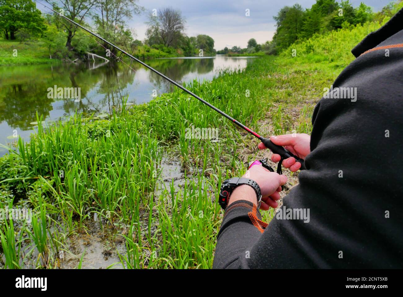 Hands holding fishing rod river hi-res stock photography and images - Alamy