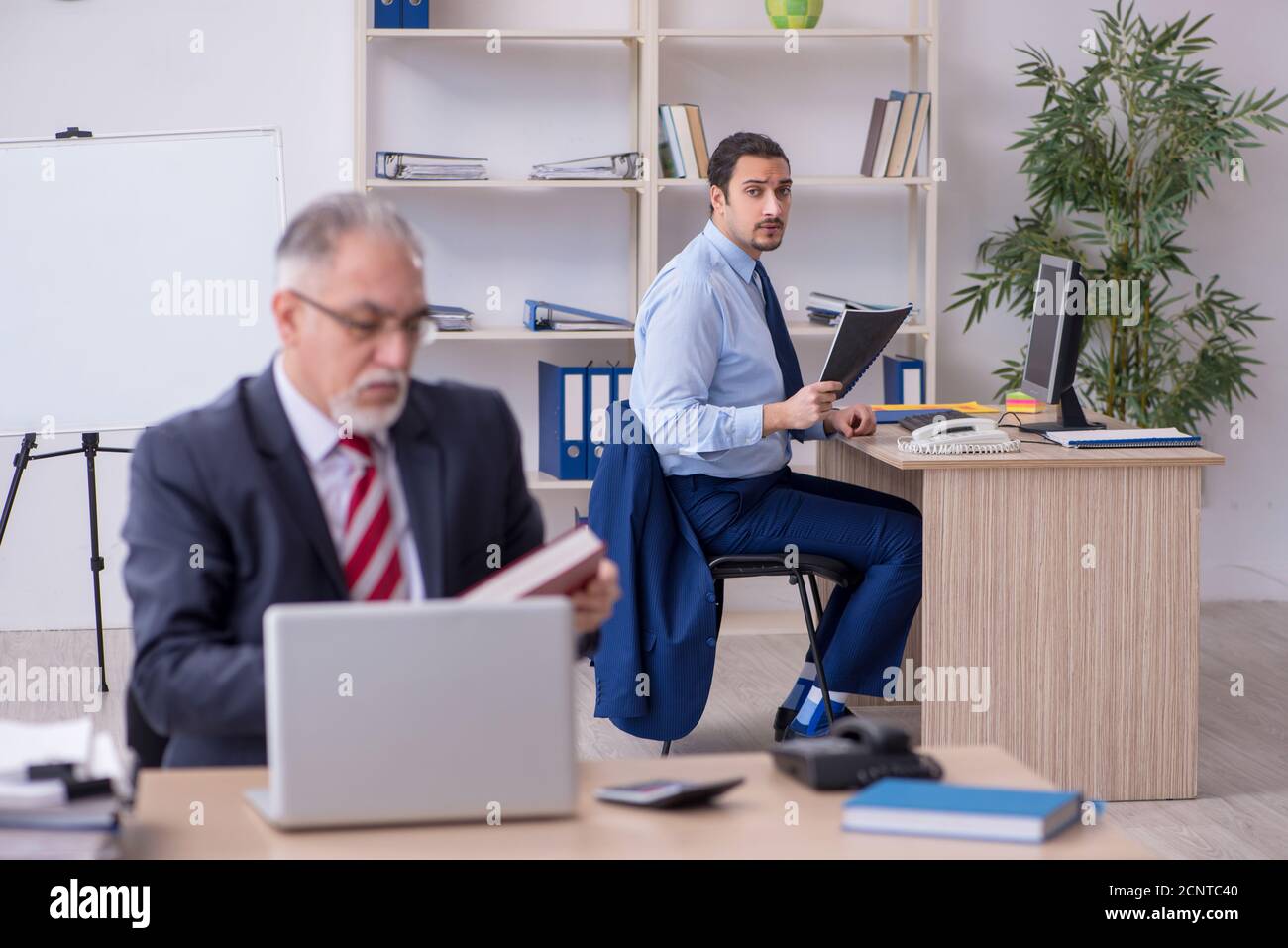 Two employees in the office environment Stock Photo - Alamy