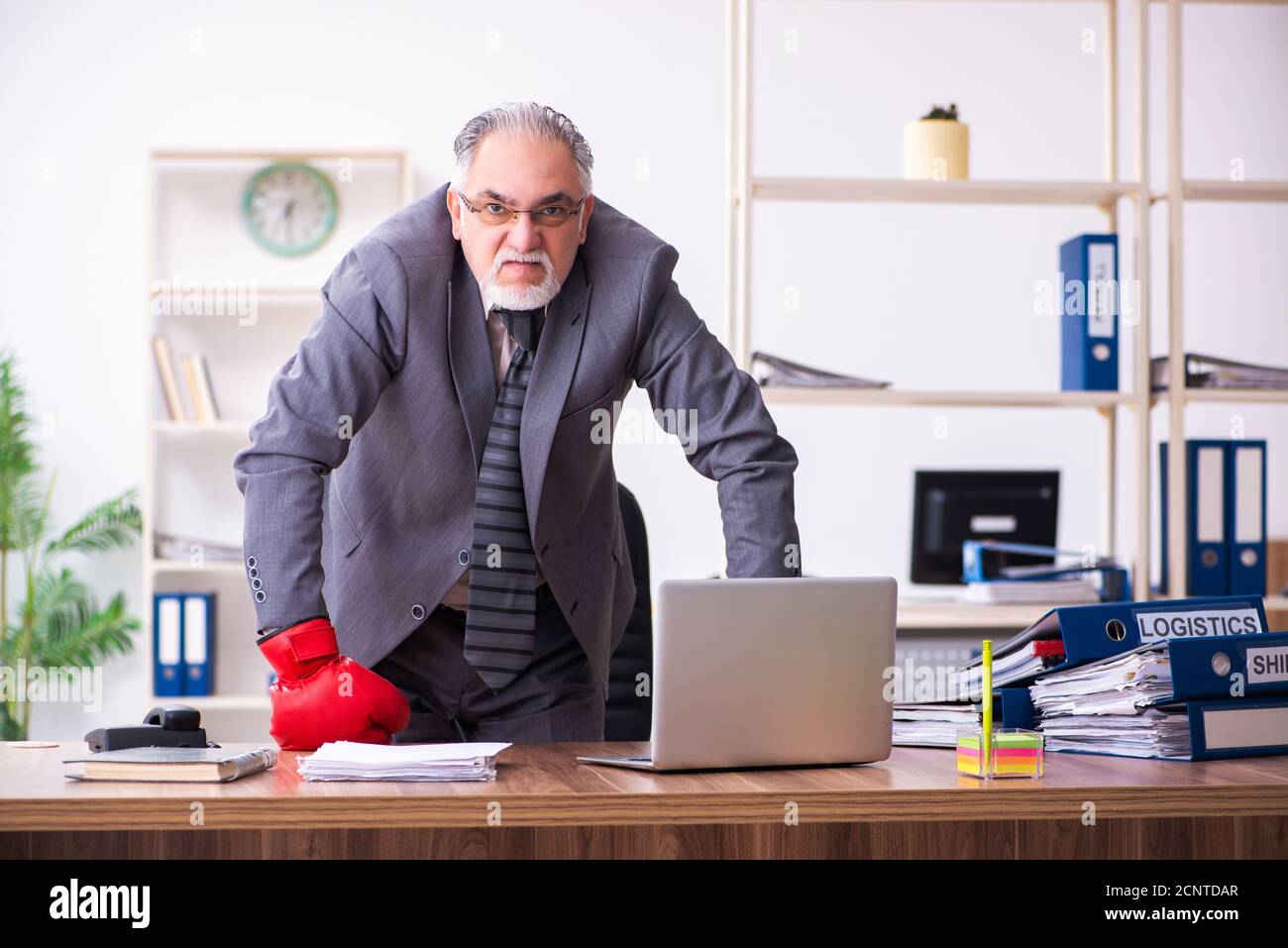 Businessman angry and furious at his workplace Stock Photo - Alamy