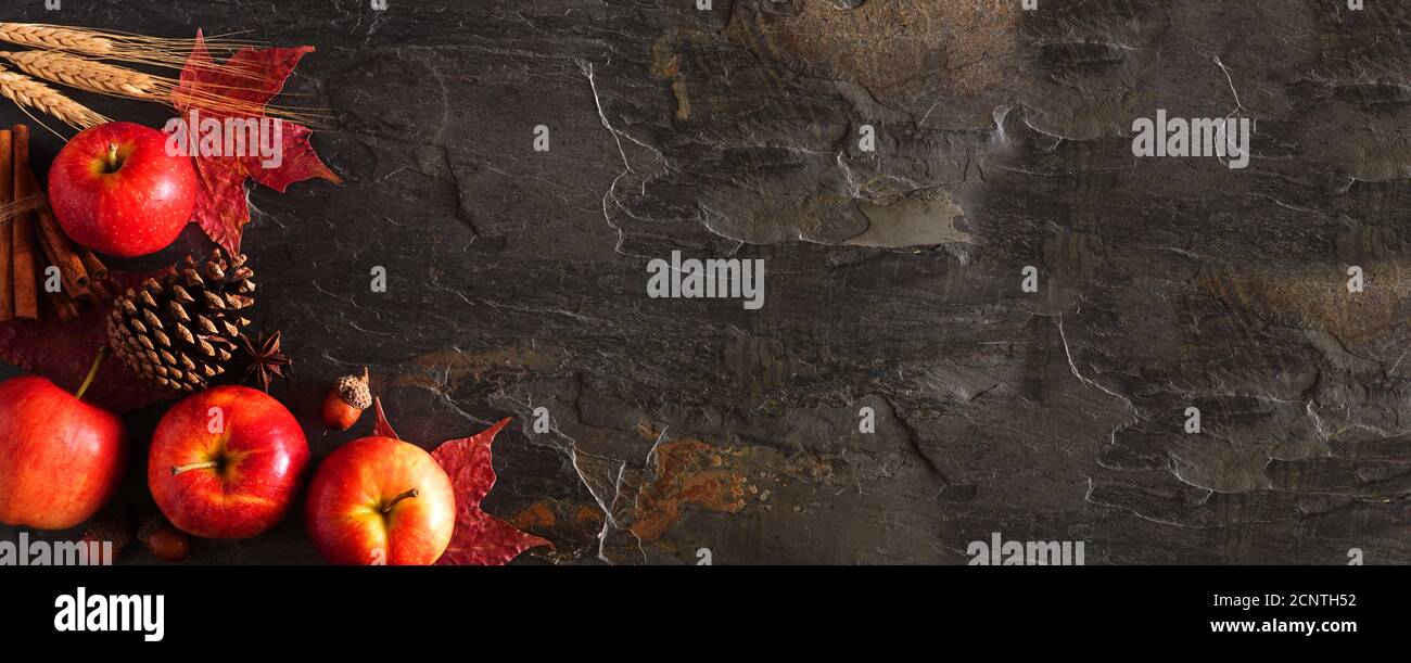 Autumn corner border banner of apples, leaves, and fall decor. Top view ...