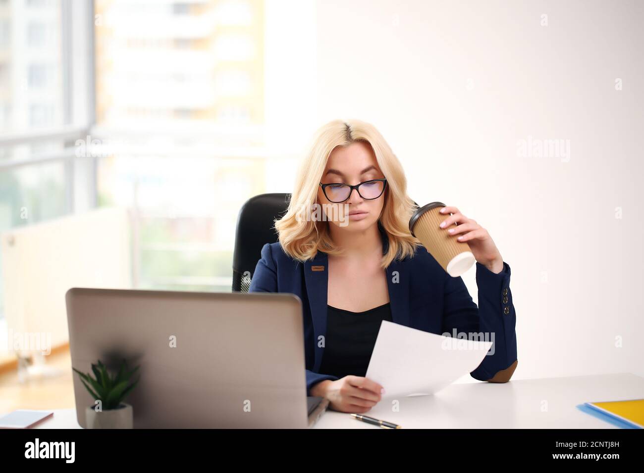 Beautiful business woman dreaming while working on computer at her ...