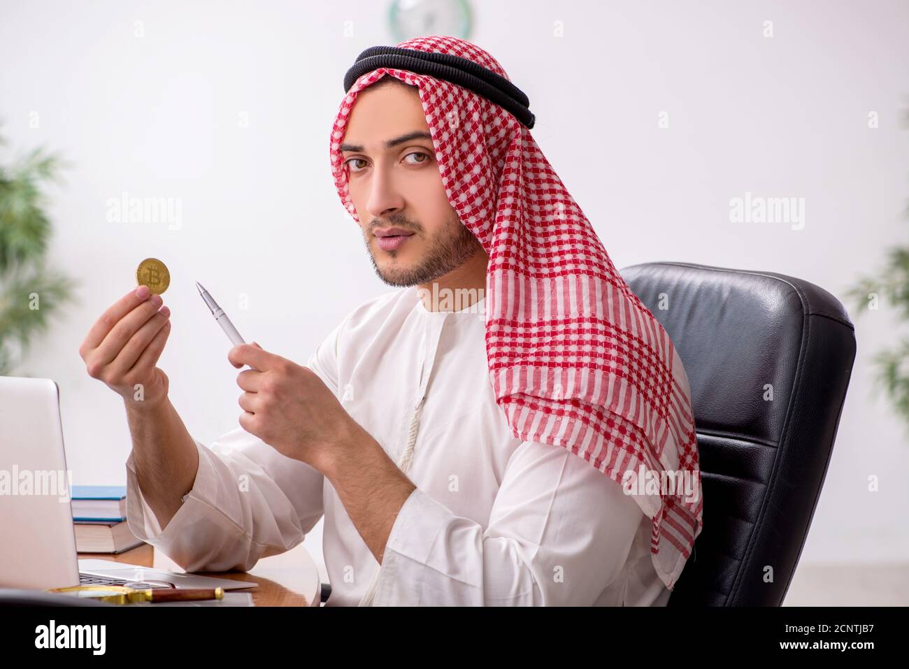 Male arab employee working in the office Stock Photo - Alamy