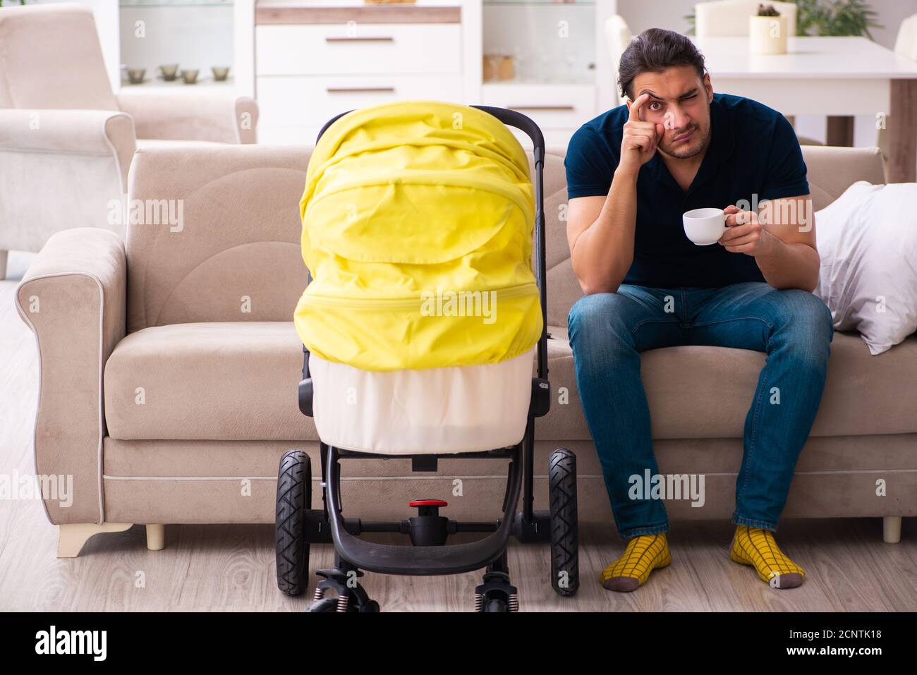 Young father looking after newborn baby Stock Photo - Alamy