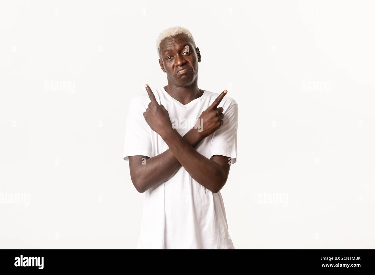 Portrait of indecisive african-american guy, shrugging and pointing ...