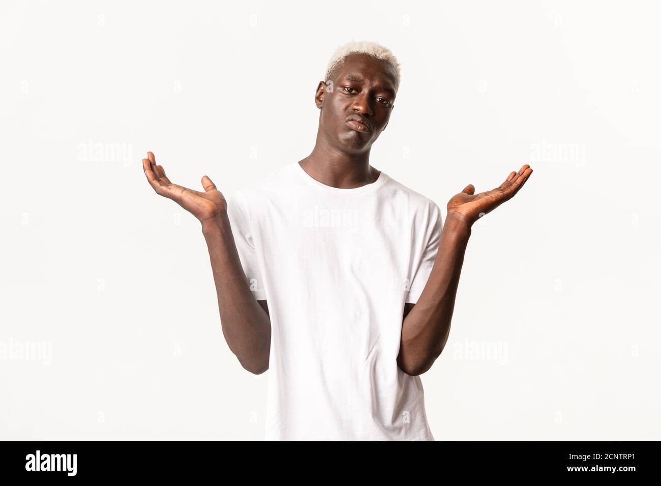 Portrait of indifferent african-american blond man, shrugging and ...