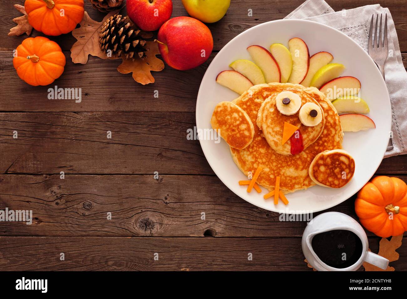 Cute Thanksgiving turkey pancakes. Top view corner border against a ...