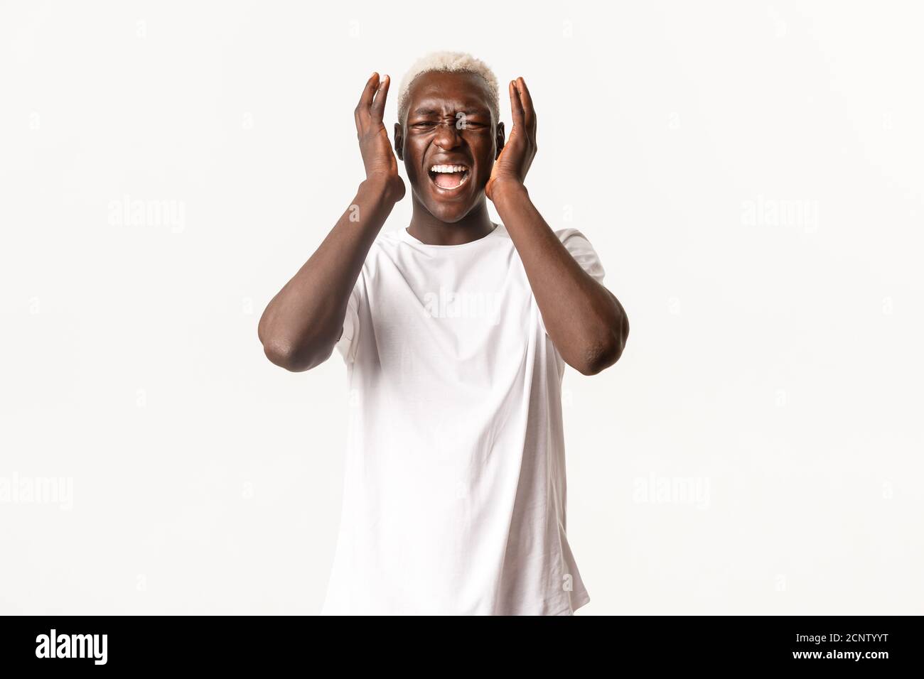 Portrait of distressed african-american panicking man, gasping and ...