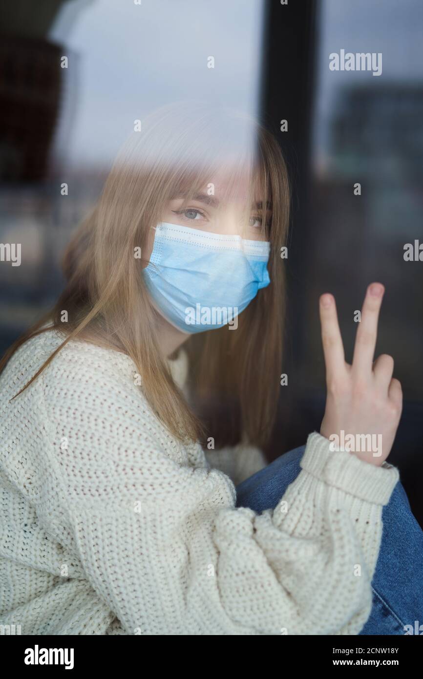 Infected covid19 virus young beautiful woman in white sweater and jeans ...