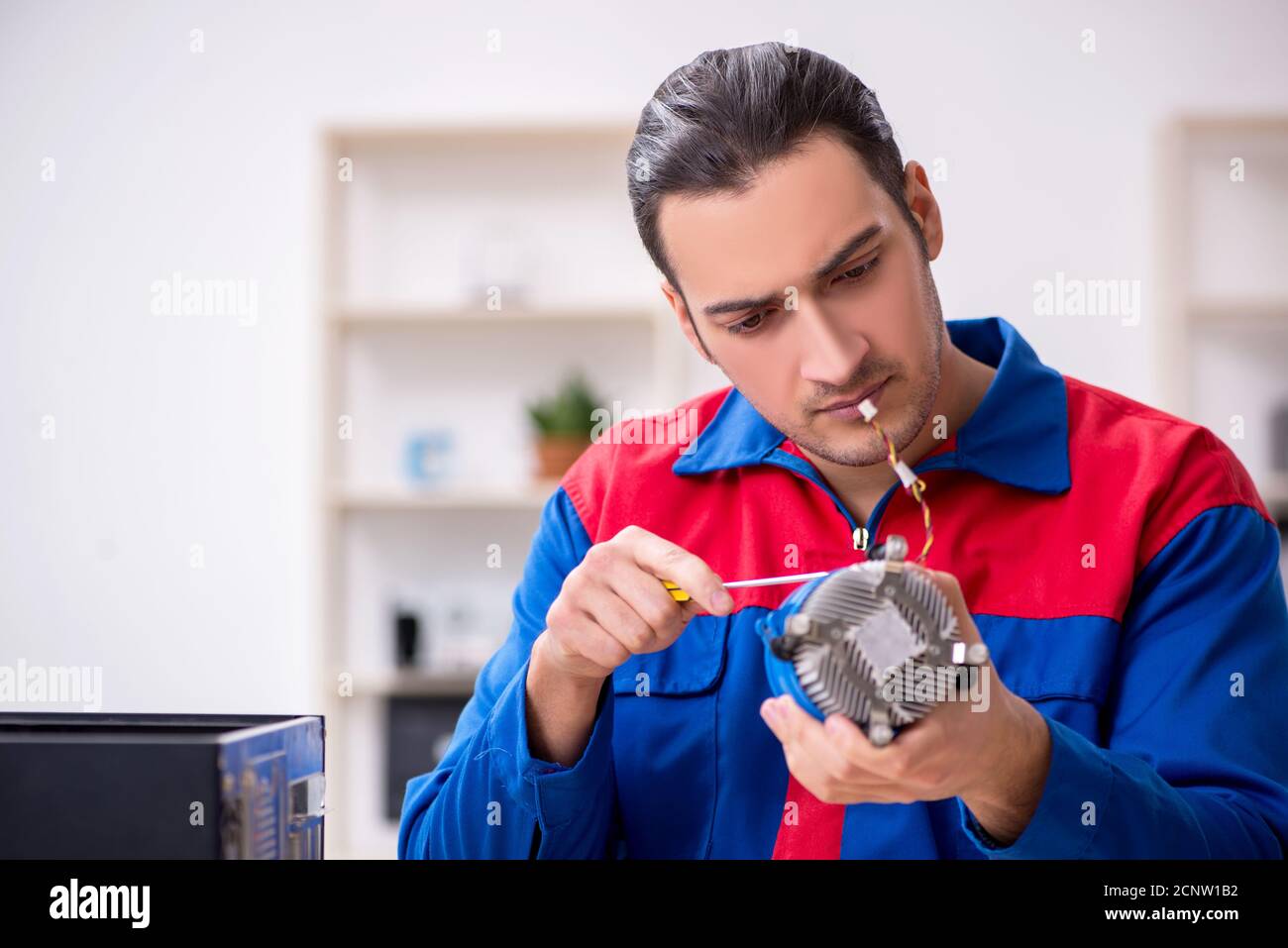 Man repairing device cooling hi-res stock photography and images - Alamy