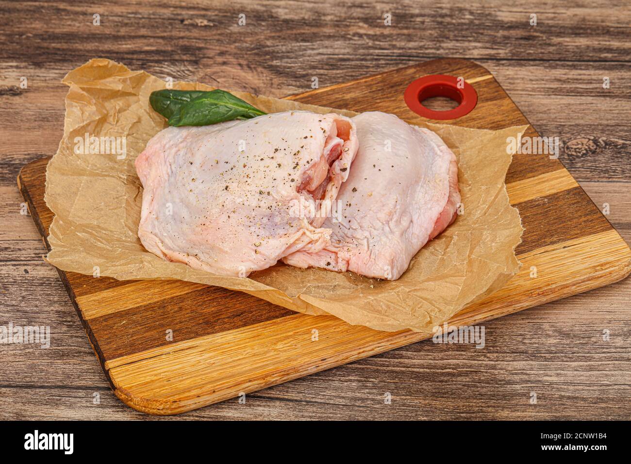 Raw chicken hip with spices ready for cooking Stock Photo - Alamy