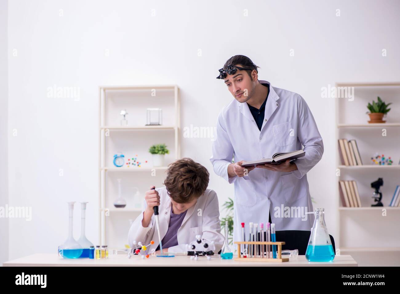 Young father and son chemists in the laboratory Stock Photo - Alamy