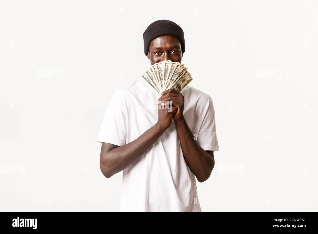 Portrait of greedy, cunning african-american young man looking pleased ...