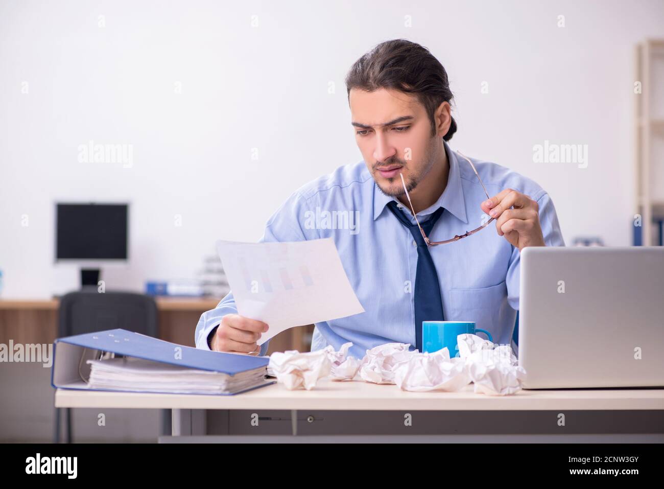 Sick male employee suffering at the workplace Stock Photo - Alamy