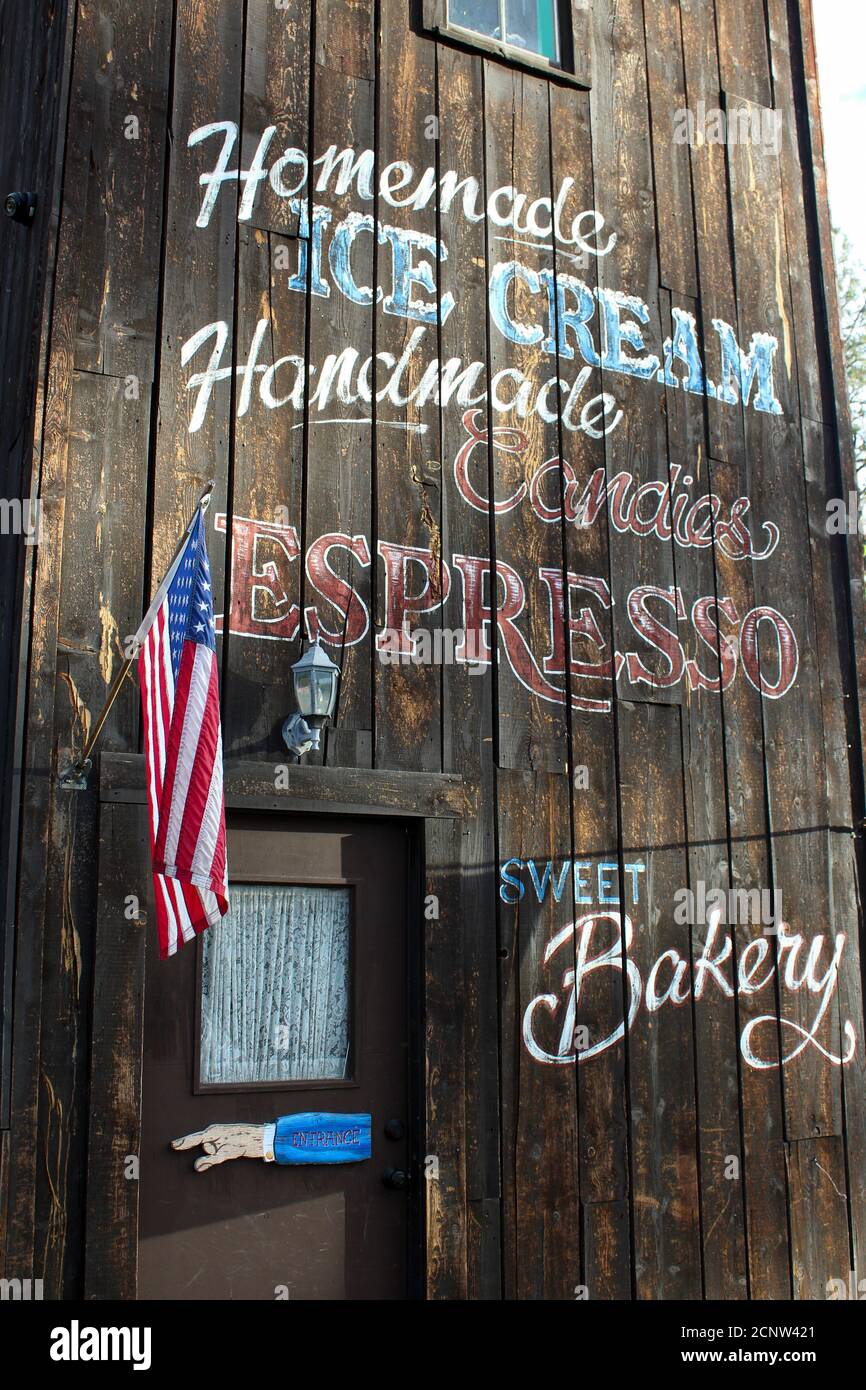 USA road trip cowboy city street painting flag Stock Photo - Alamy