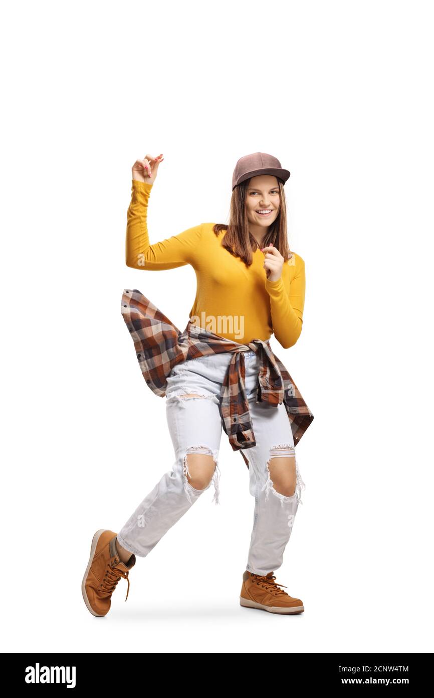 Full length portrait of a cheerful young casual female dancing isolated ...