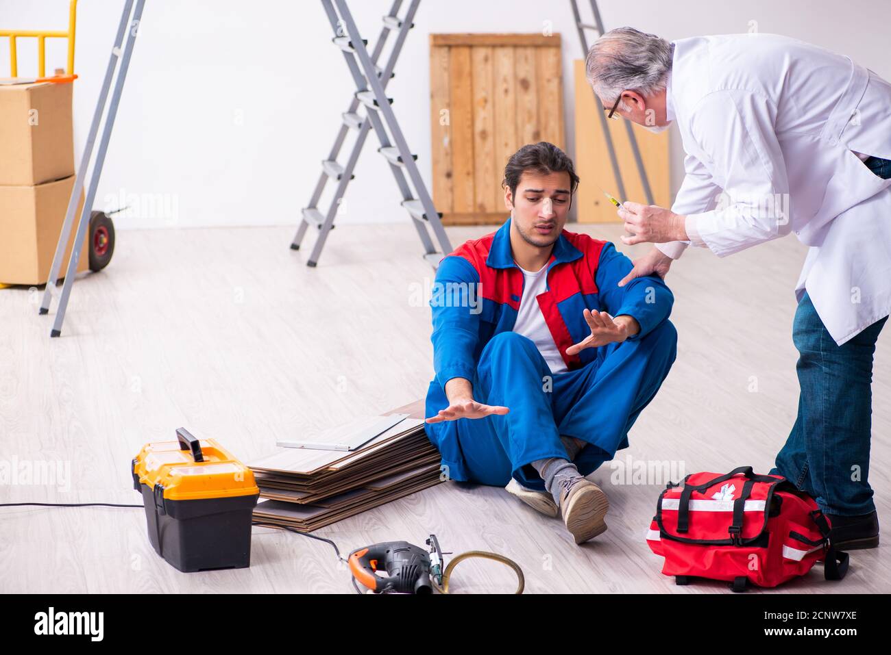 Experienced paramedic helping worker bitten by snake Stock Photo - Alamy