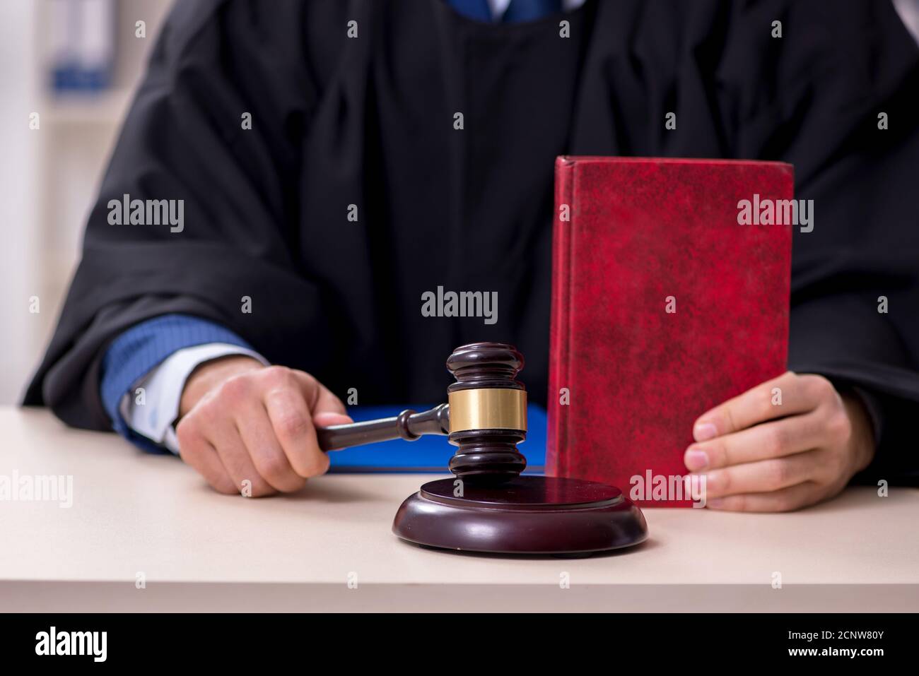 Young judge working in courthouse Stock Photo - Alamy