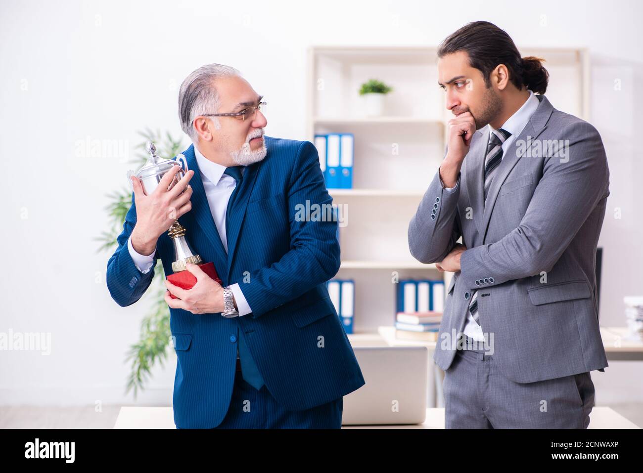 Two employees working in the office Stock Photo - Alamy