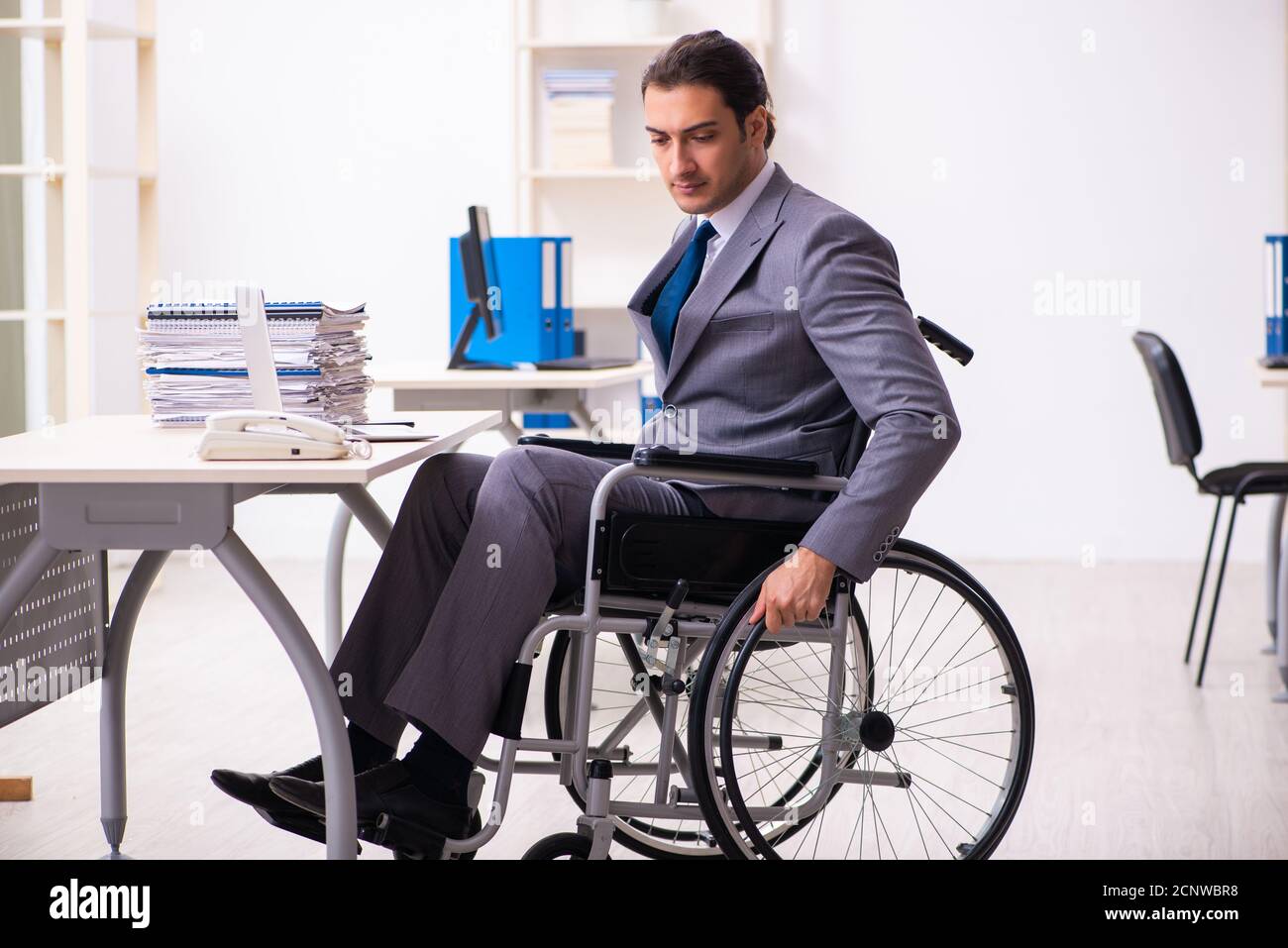 Disabled employee in the office environment Stock Photo - Alamy