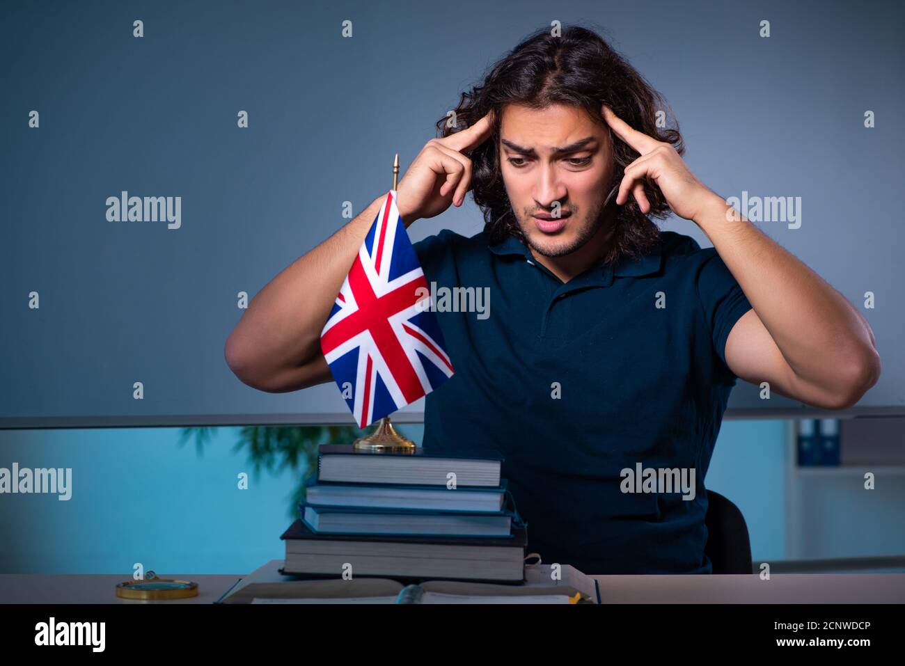Young student in the classroom at night Stock Photo - Alamy