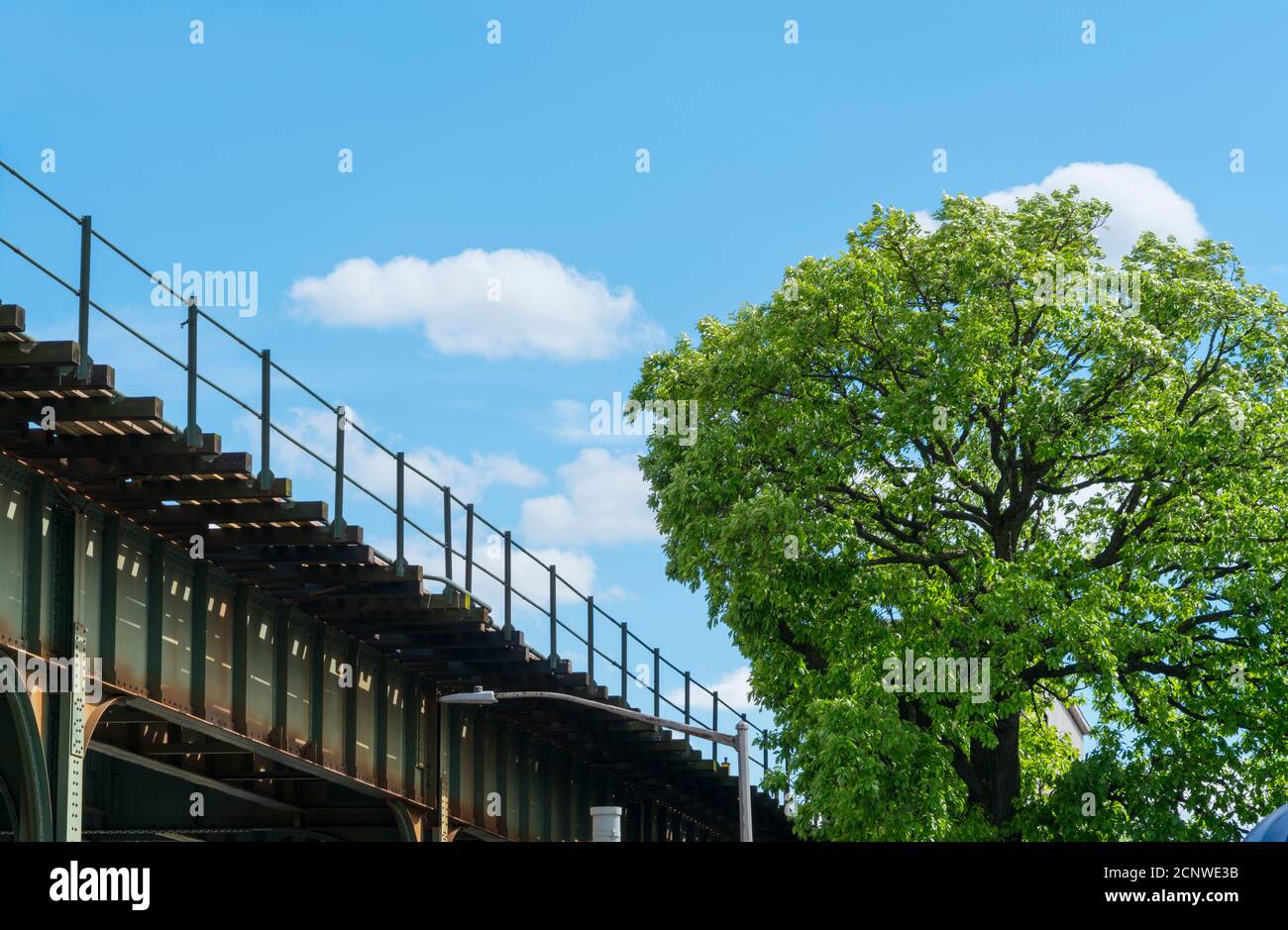 New York City subway runs on the elevated railway track at Queens New ...