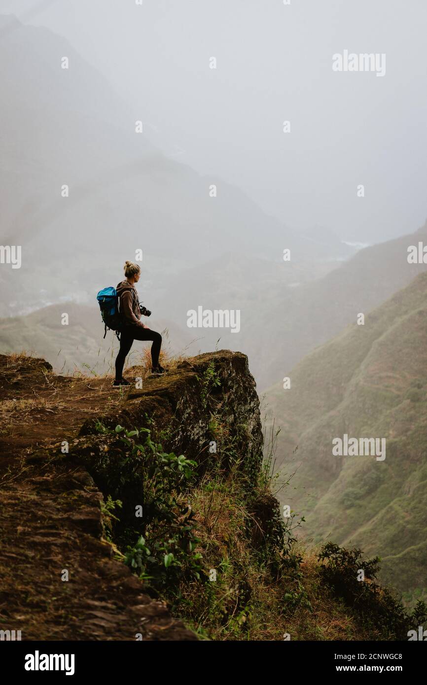 Female tourist looking down the Paul valley with gorgeous panorama view ...