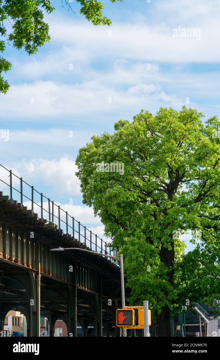 New York City subway runs on the elevated railway track at Queens New ...