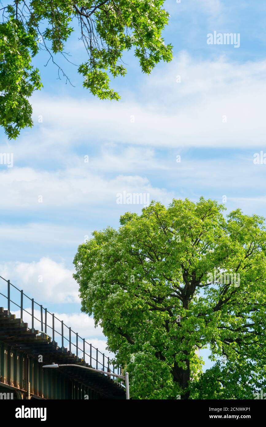 New York City subway runs on the elevated railway track at Queens New ...