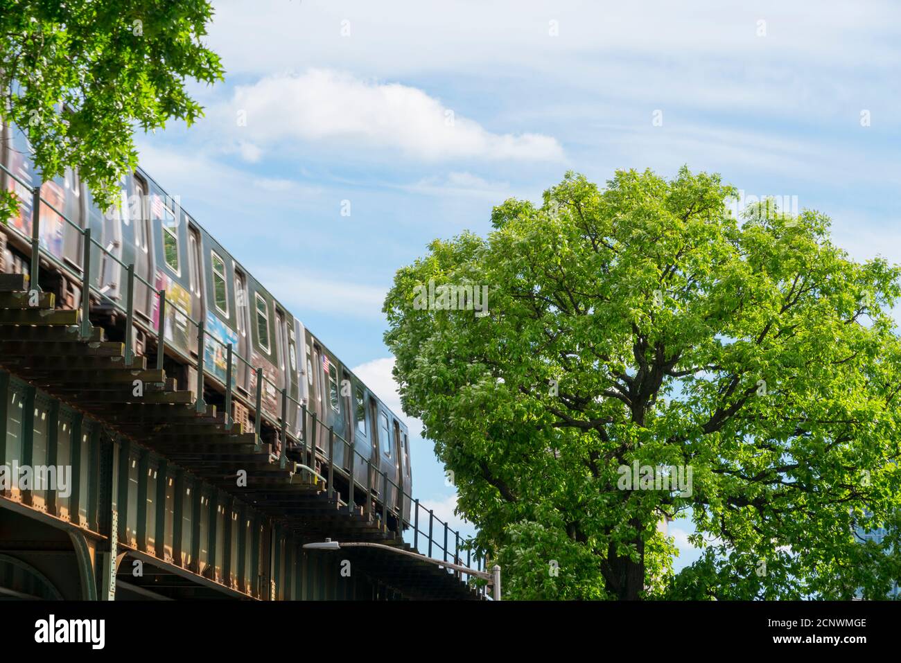 New York City subway runs on the elevated railway track at Queens New ...