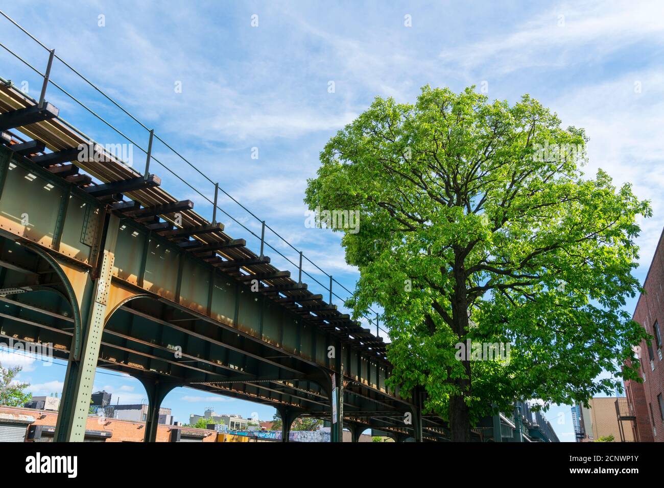 New York City subway runs on the elevated railway track at Queens New ...