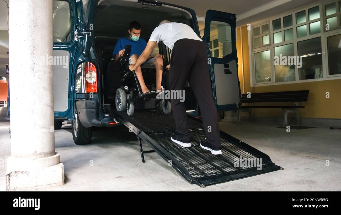 Man pushing wheel chair ramp hi-res stock photography and images - Alamy