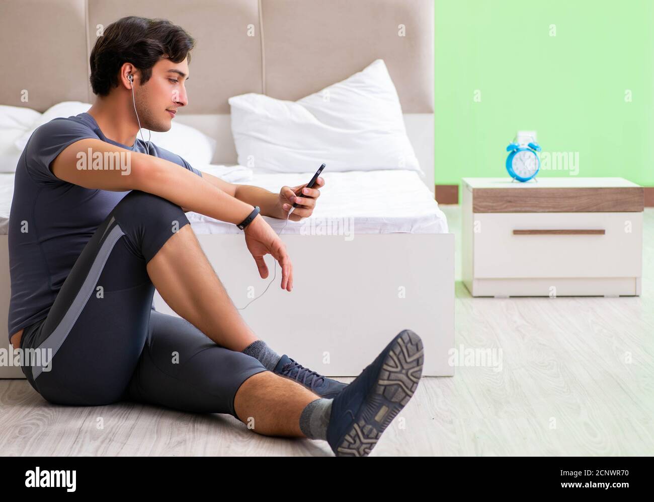 The young handsome man doing morning exercises in the hotel room Stock ...