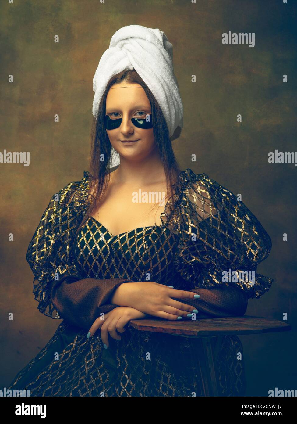 Beauty routine. Young woman as Mona Lisa, La Gioconda isolated on dark ...