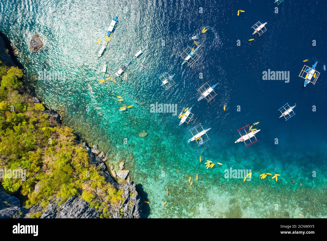 top down view of tourist boats close to big lagoon, aerial view ...