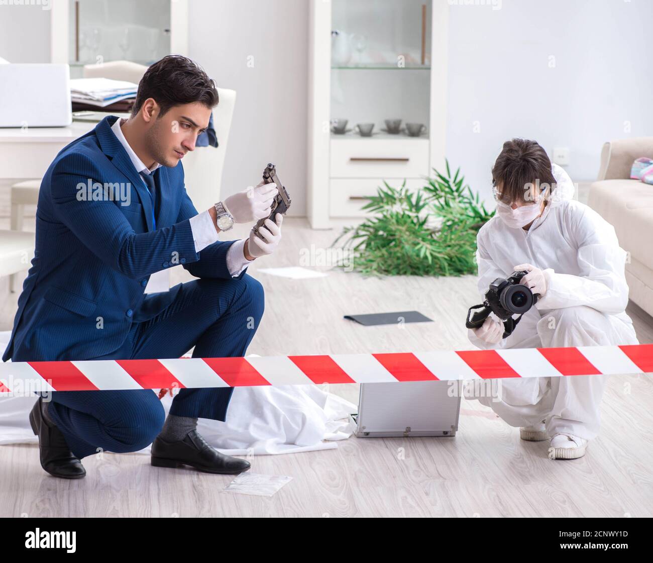 The forensics investigator at the scene of office crime Stock Photo - Alamy