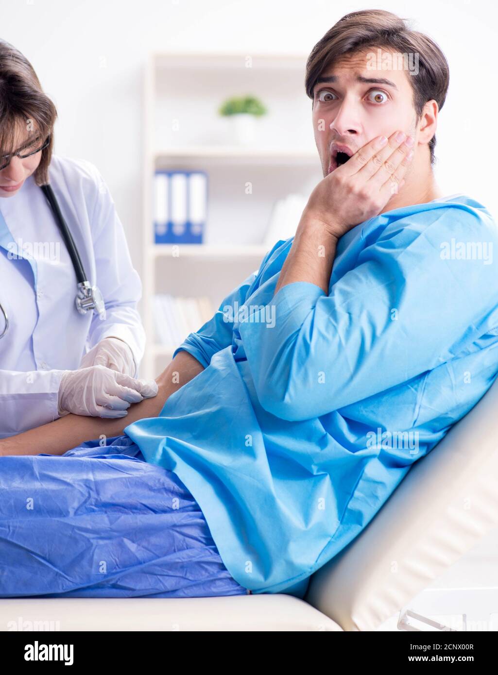 The scared patient man getting ready for flu shot Stock Photo - Alamy