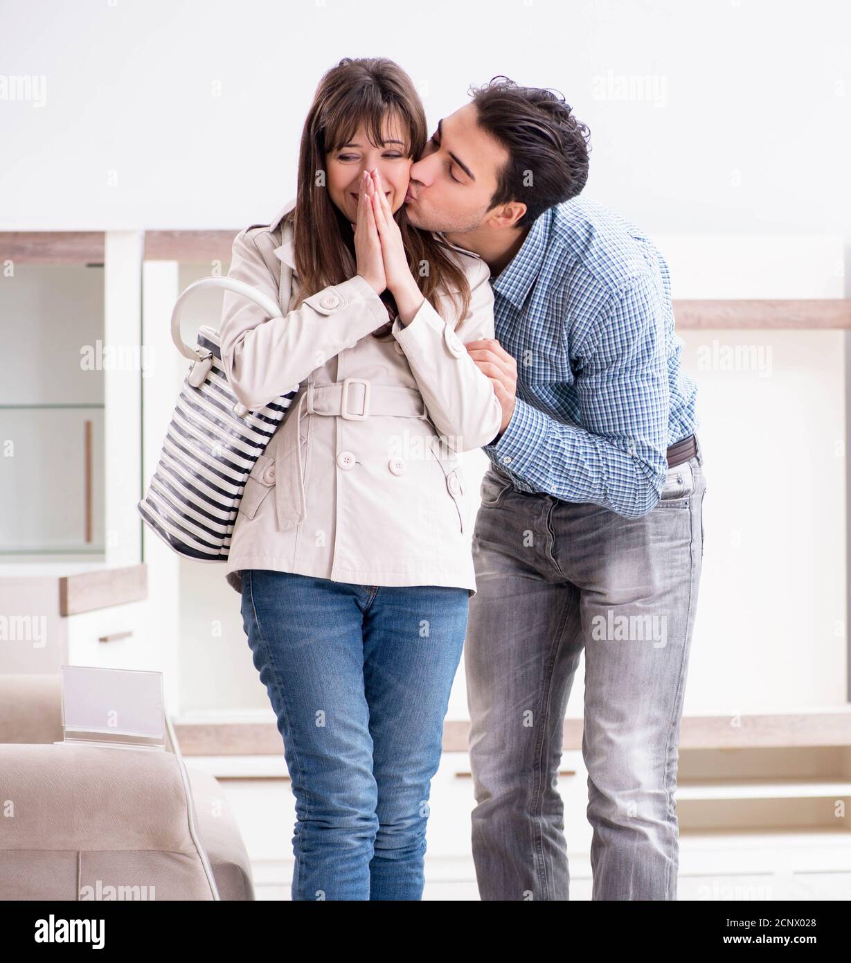 Woman kissing man in check hi-res stock photography and images - Alamy