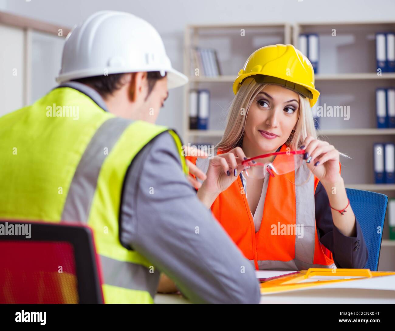 Construction workers having discussion in office before starting ...