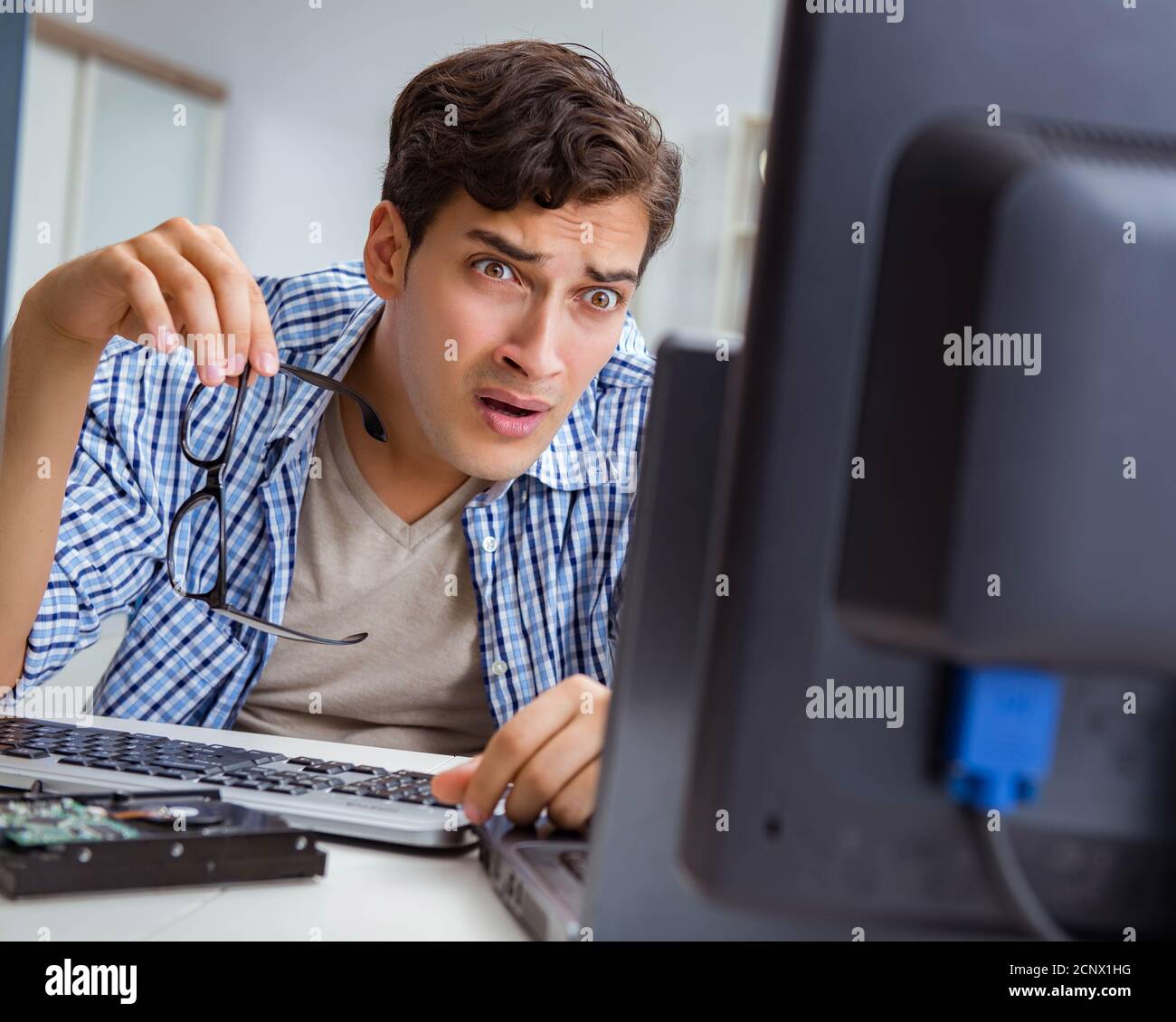 The young trader monitoring markets on screens Stock Photo - Alamy