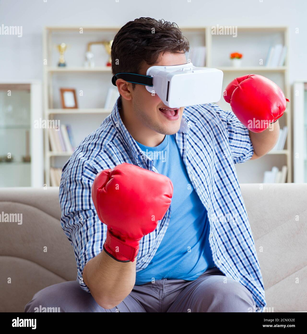 The man wearing virtual reality vr glasses playing boxing game Stock ...