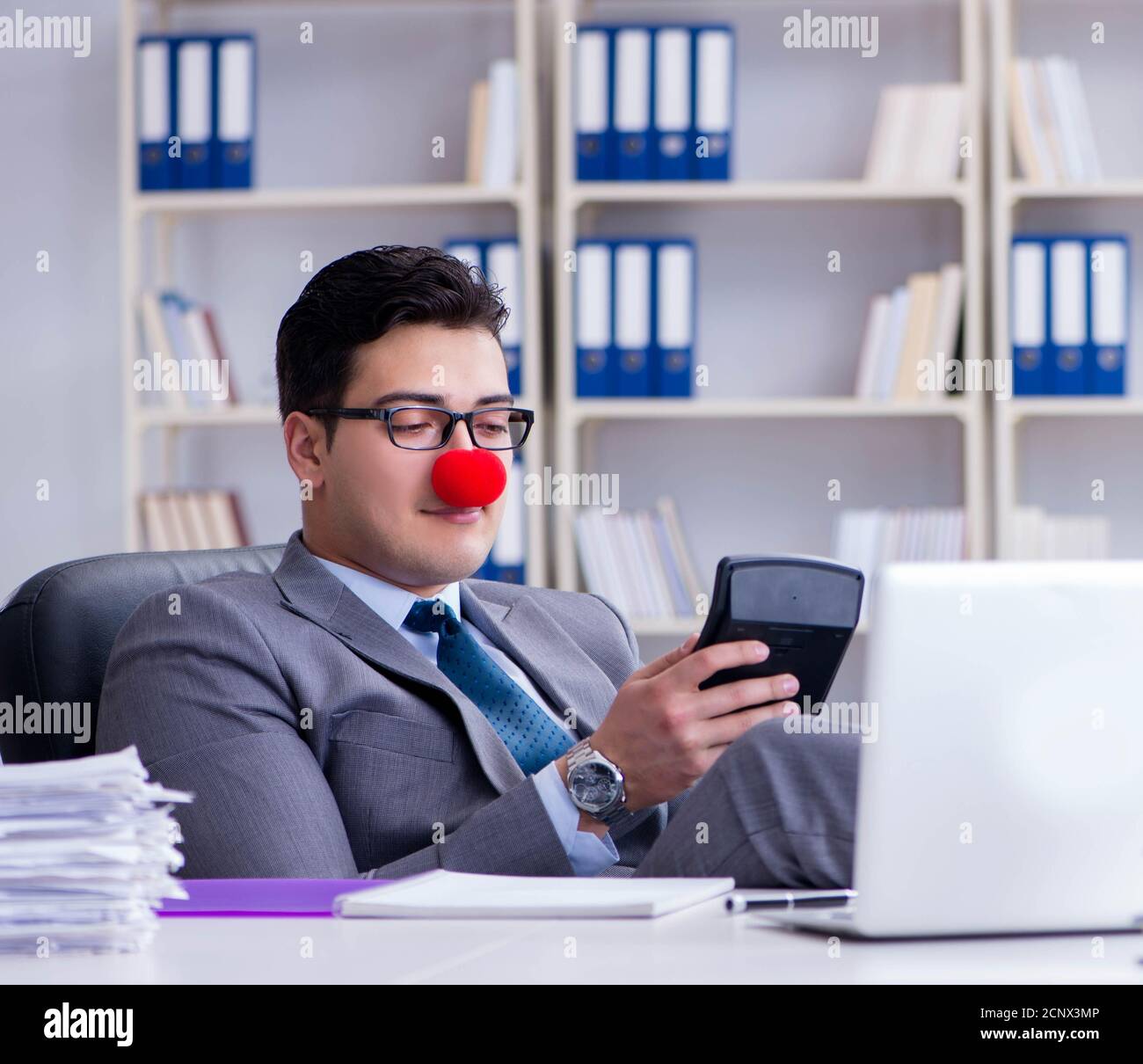 The clown businessman working in the office Stock Photo - Alamy