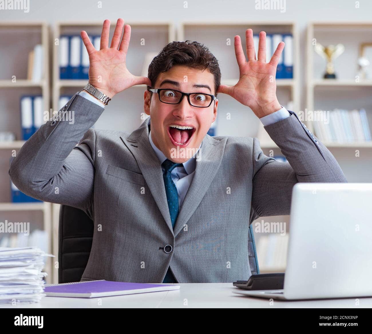 The funny businessman clown acting silly in the office Stock Photo - Alamy