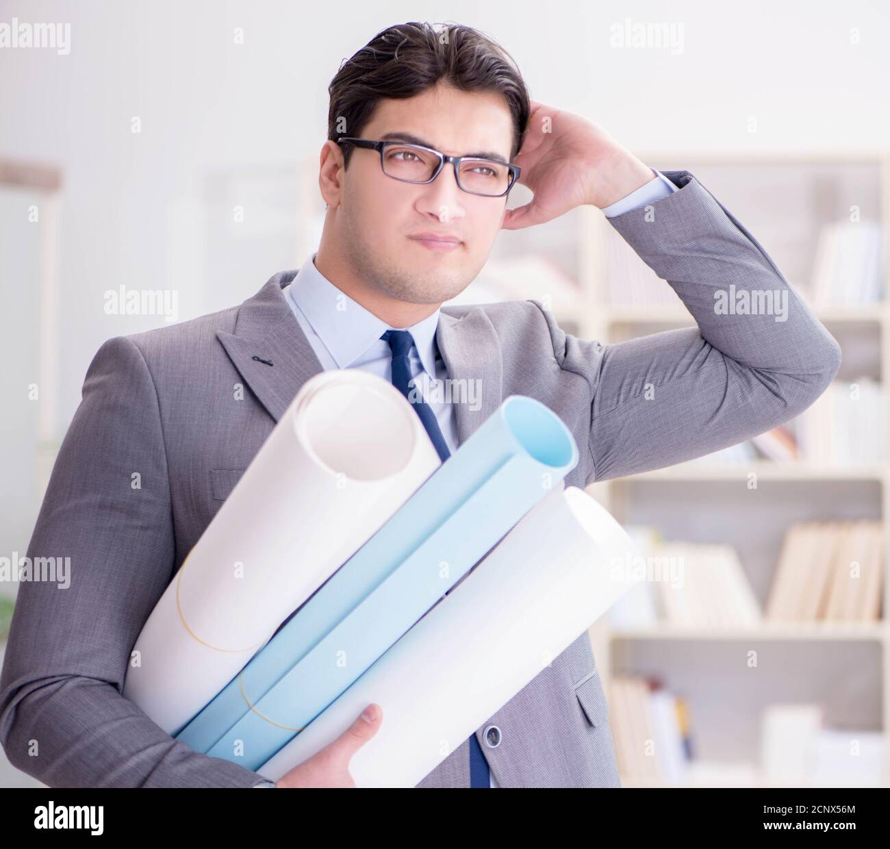 Businessman engineer draftsman with blueprints drawings Stock Photo - Alamy