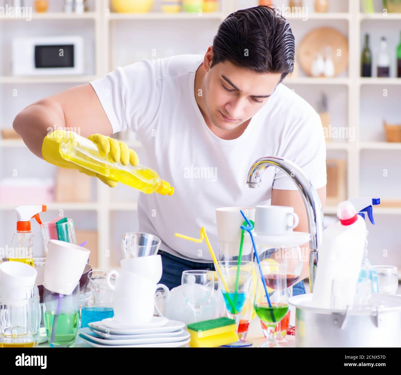 The man enjoying dish washing chores at home Stock Photo - Alamy