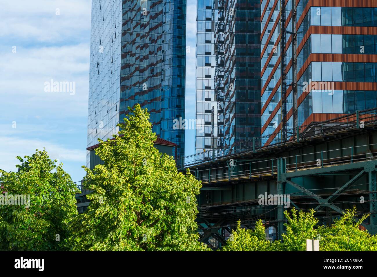 New York City subway runs on the elevated railway track at Queensboro ...