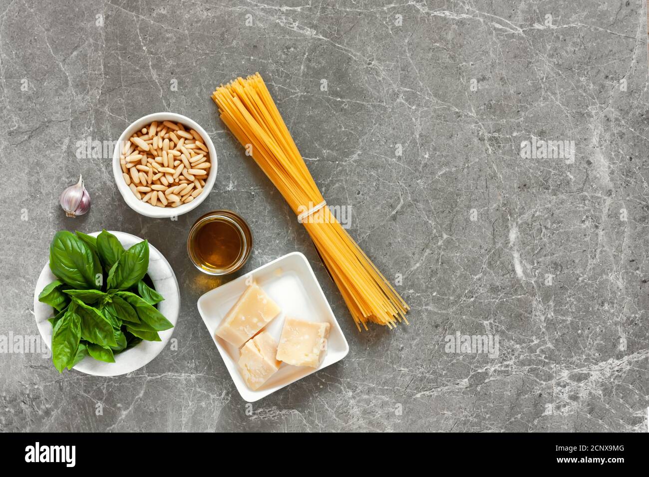 Pasta with pesto ingredients. Top view of spaghetti, basil, pine nuts ...