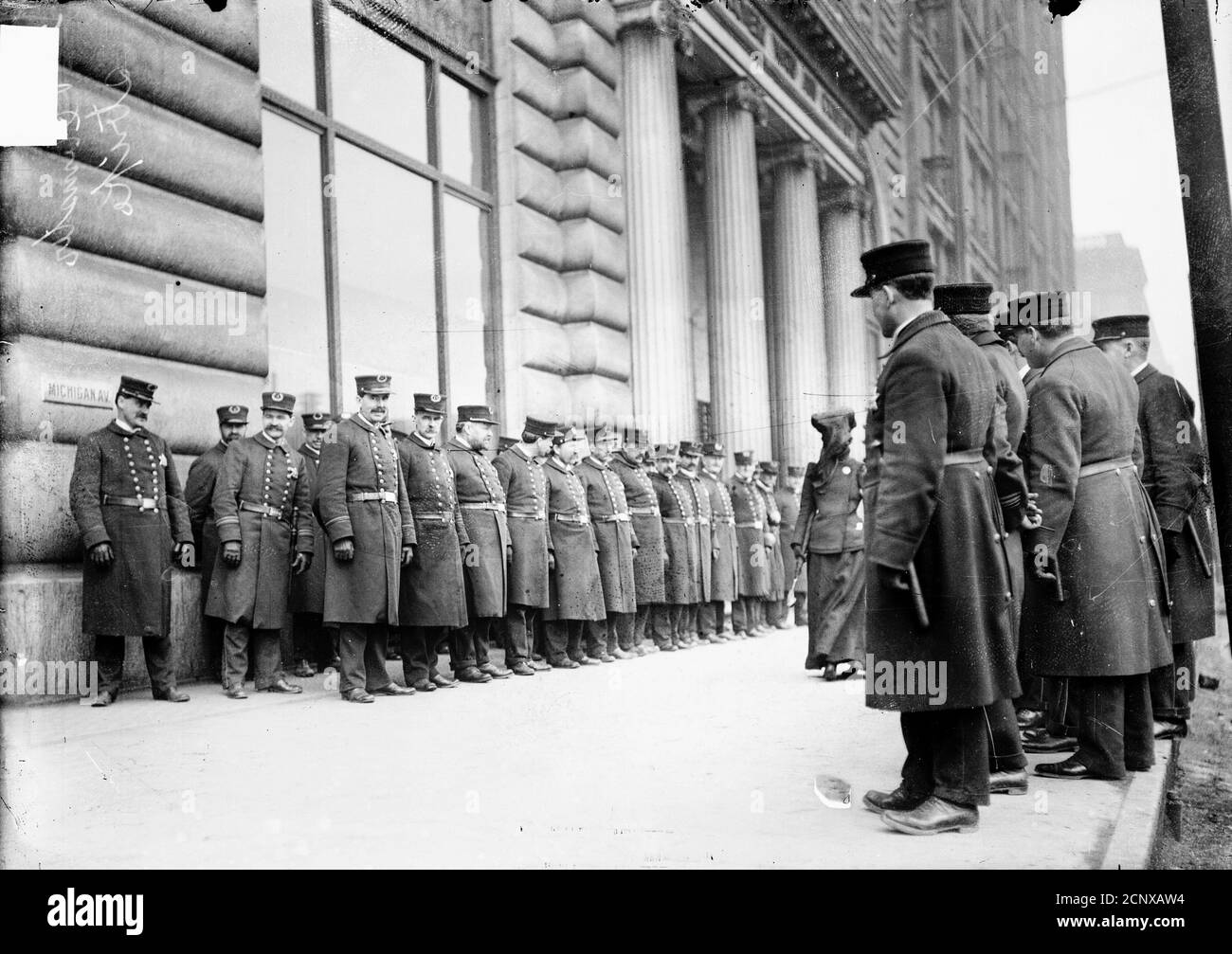 Teamsters Strike, veiled woman walking between rows of police in front ...