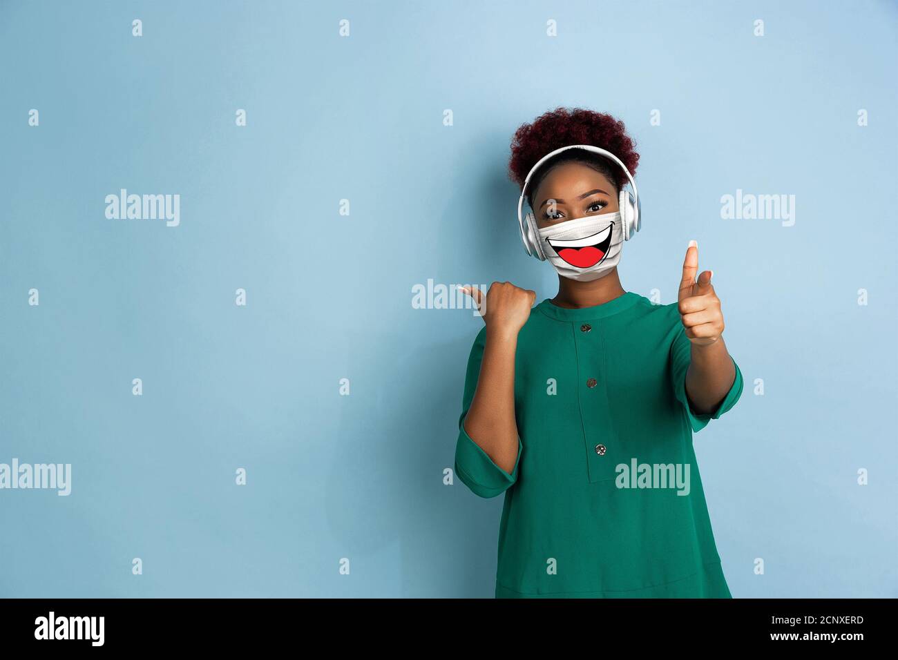 Music listening. Portrait of young girl with emotion on her face mask ...